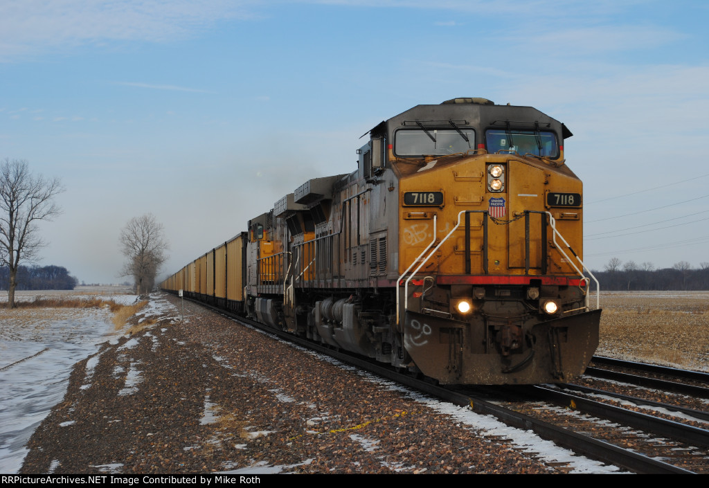 Southbound coal bucket led by Union Pacific 7118 rolls by.